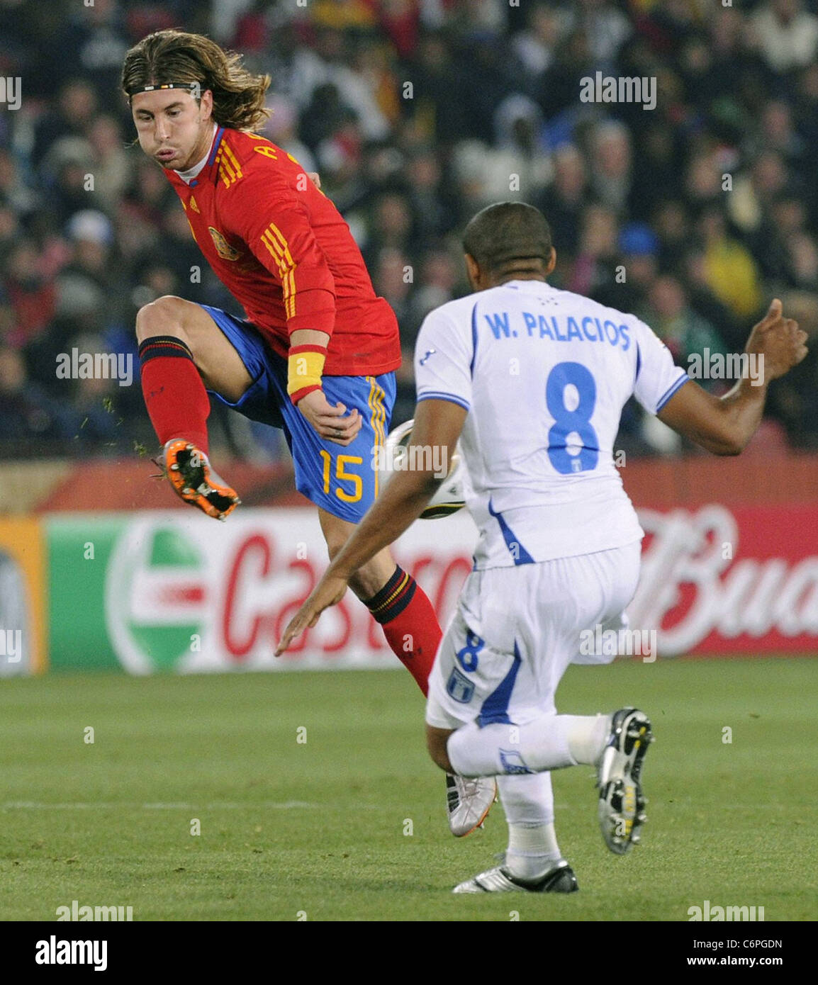 Spain defender Sergio Ramos (L) take on Honduras midfielder Wilson ...