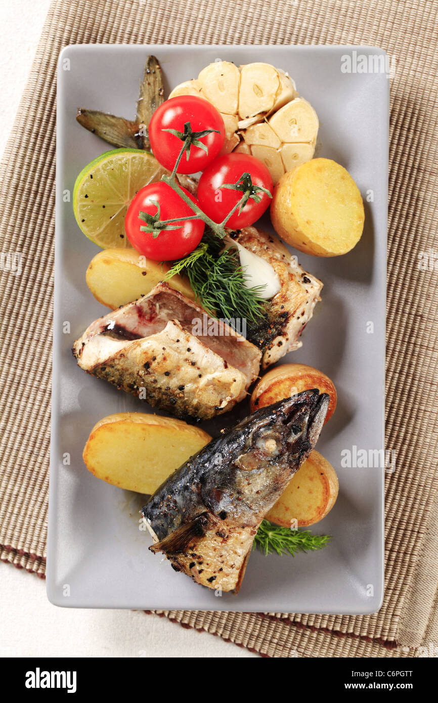 Pan fried mackerel served with roasted potatoes Stock Photo - Alamy