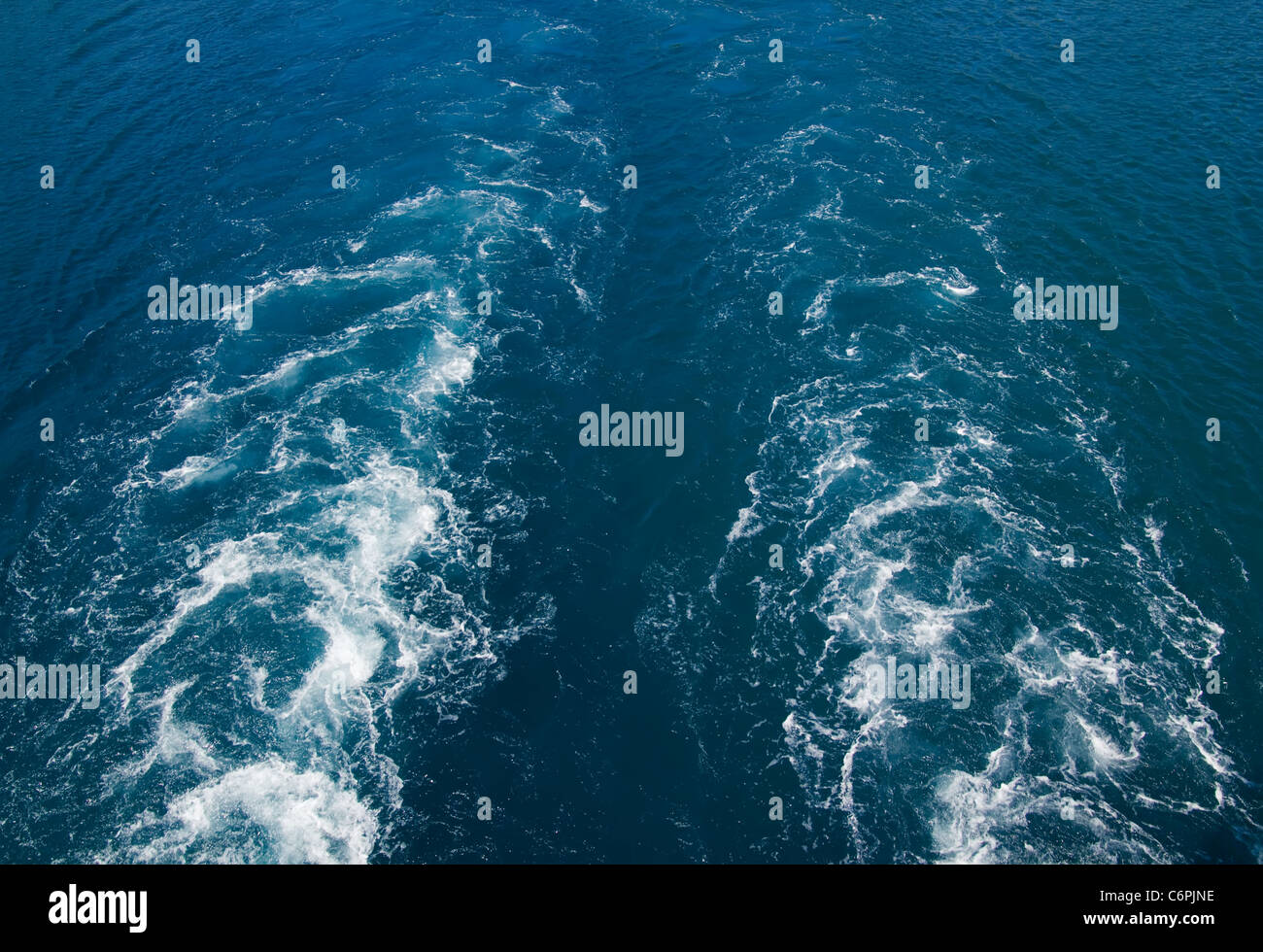 Water wake swirls background from ferry boat Stock Photo - Alamy