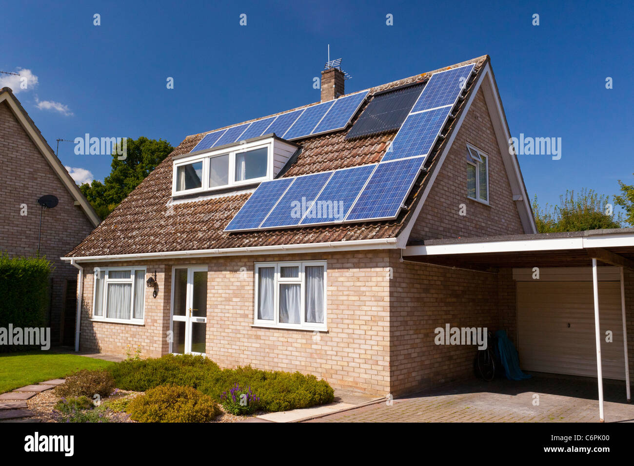 Solar panels on a domestic roof hi-res stock photography and images - Alamy