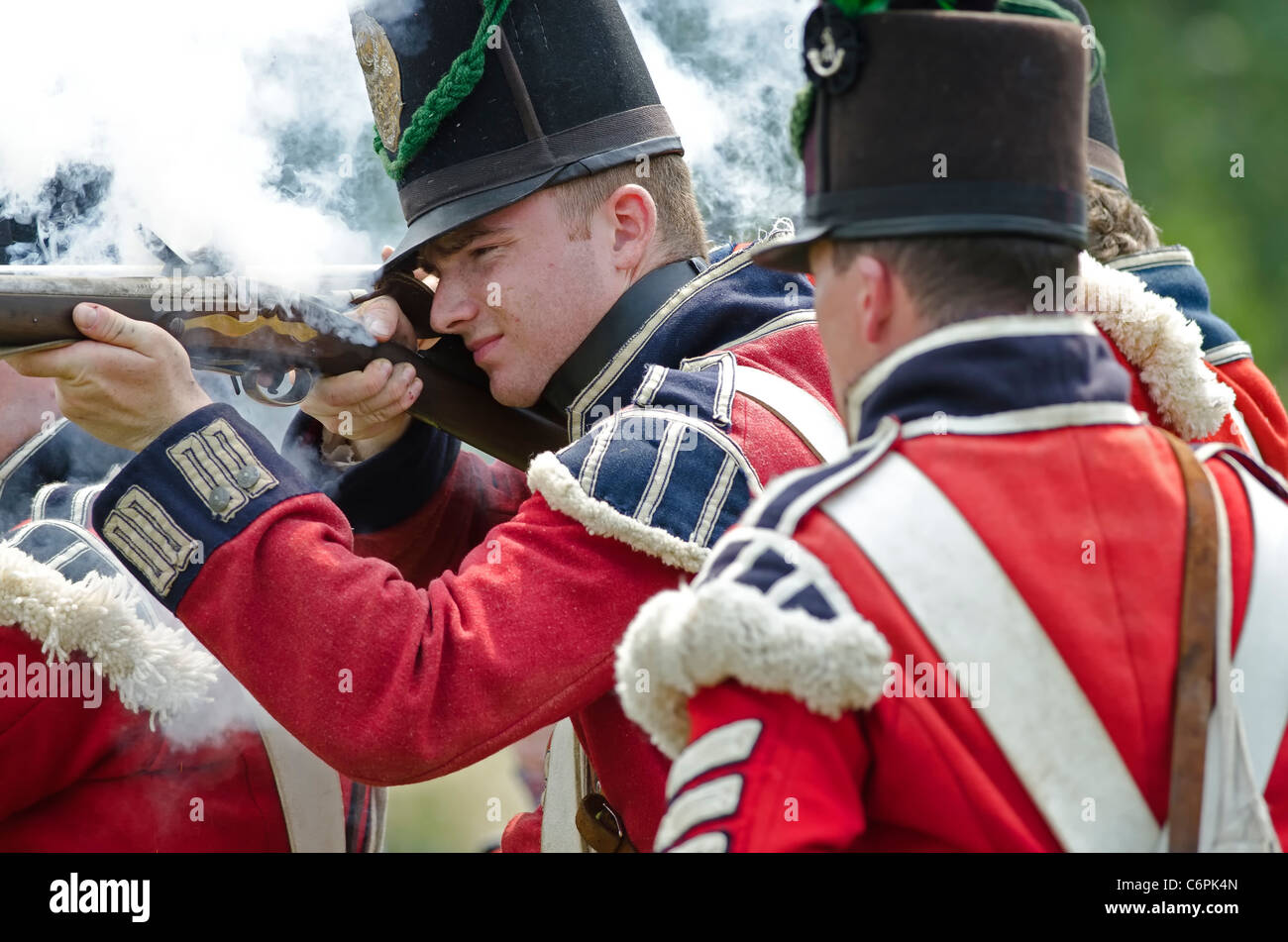 British soldier fires his weapon at the American Infantry at the annual ...