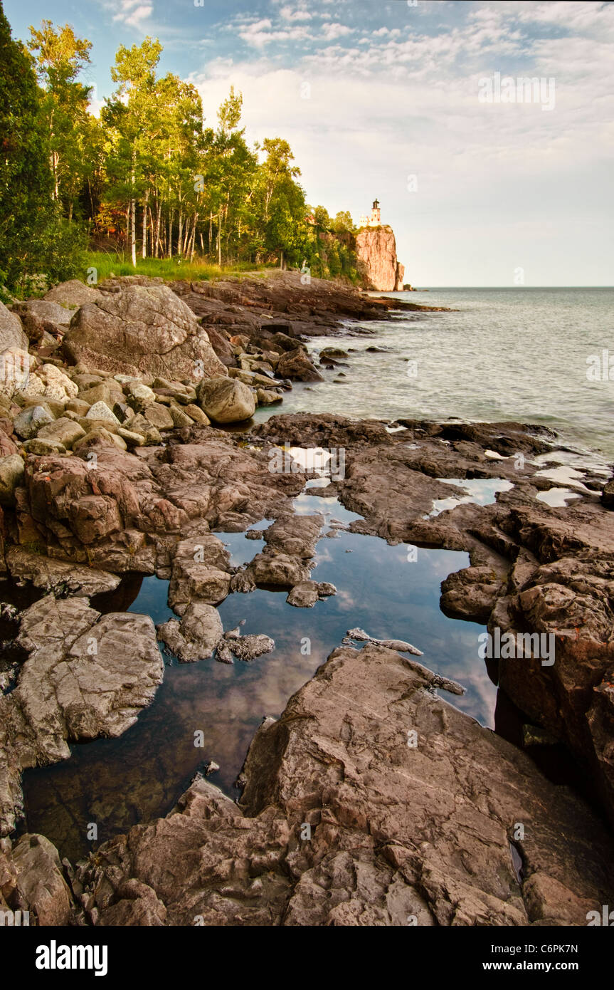 The shore of Lake Superior with Split Rock Lighthouse in the distance ...