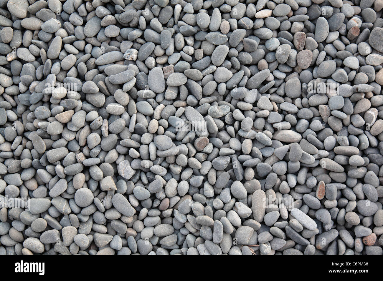 Pebbles on a beach Stock Photo - Alamy