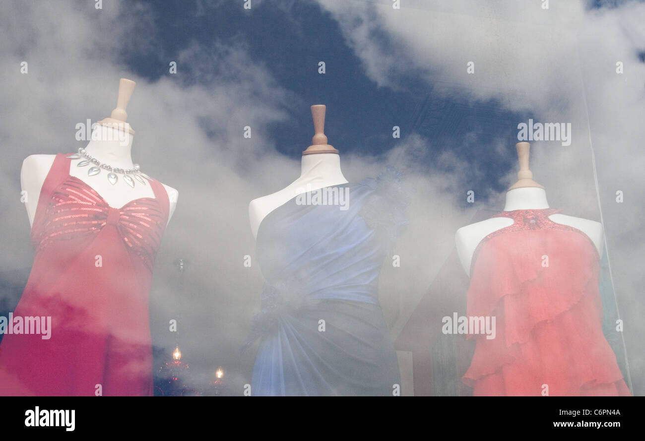 Shop window display of dresses against sky reflections Stock Photo - Alamy