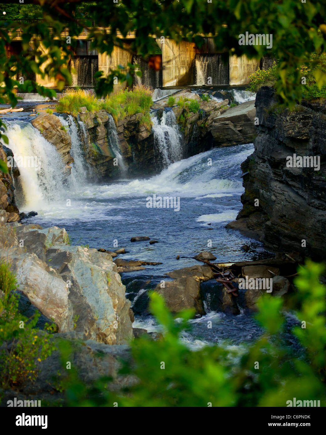 The scenic view through forest trees of Hog's Back waterfalls on the ...