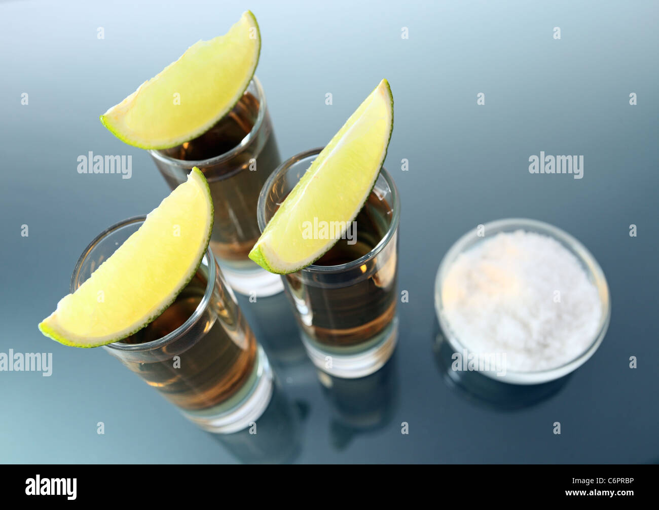 tequila on a glass table Stock Photo - Alamy