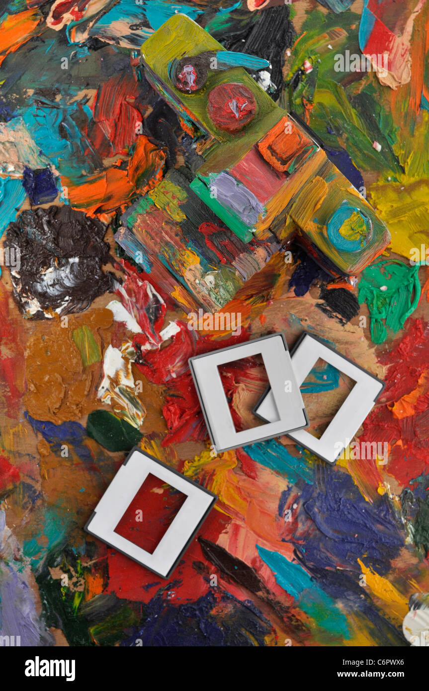 colorful painted SLR photograph camera on the palette Stock Photo - Alamy