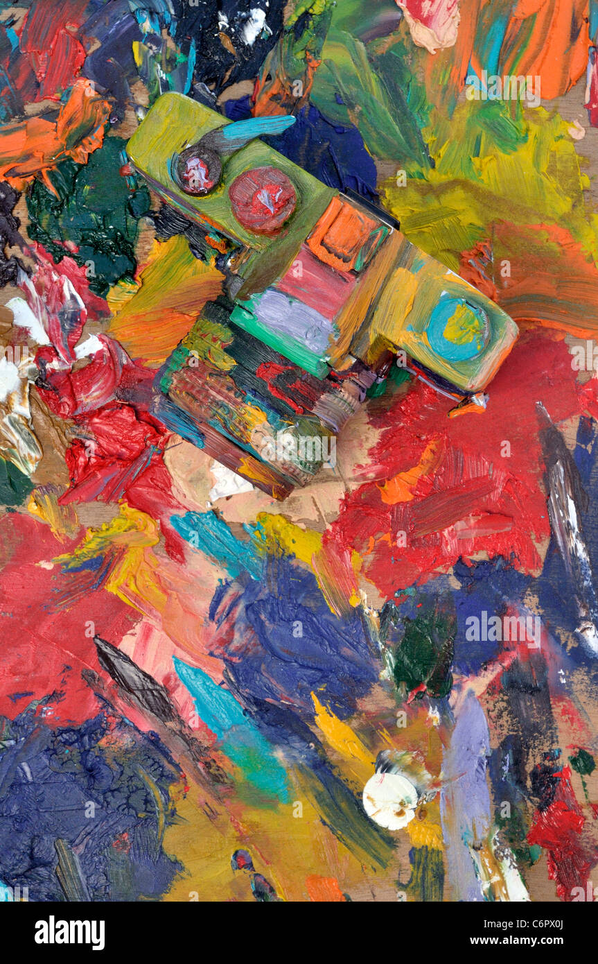 colorful painted SLR photograph camera on the palette Stock Photo - Alamy