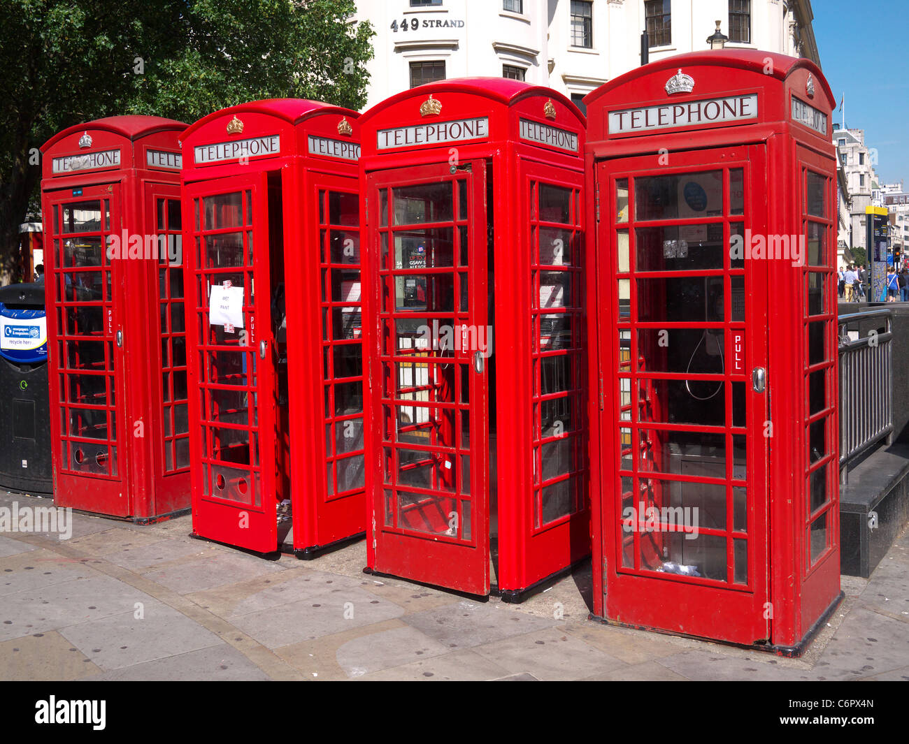 A row of traditional red London telephone boxes Stock Photo - Alamy