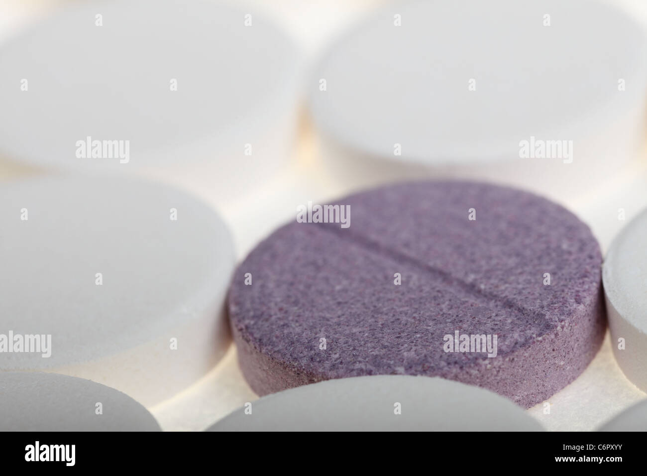 white big pills background - one pill stand out others Stock Photo - Alamy