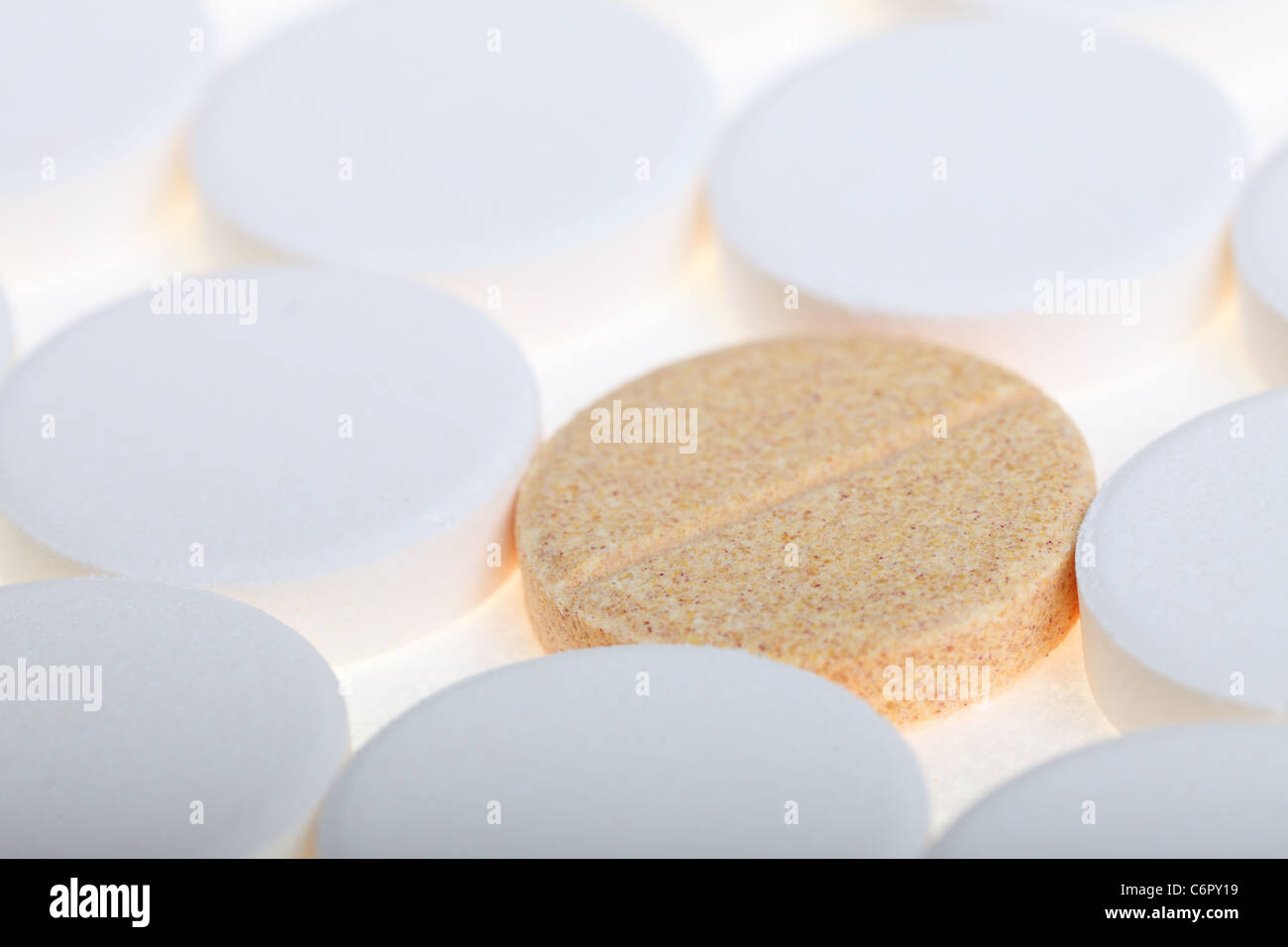 white big pills background - one pill stand out others Stock Photo - Alamy