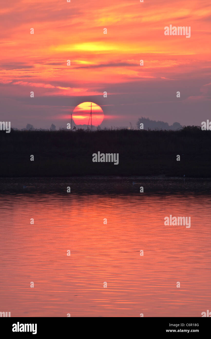 Sun Just Risen Reflects on Blackwater Estuary Stock Photo - Alamy