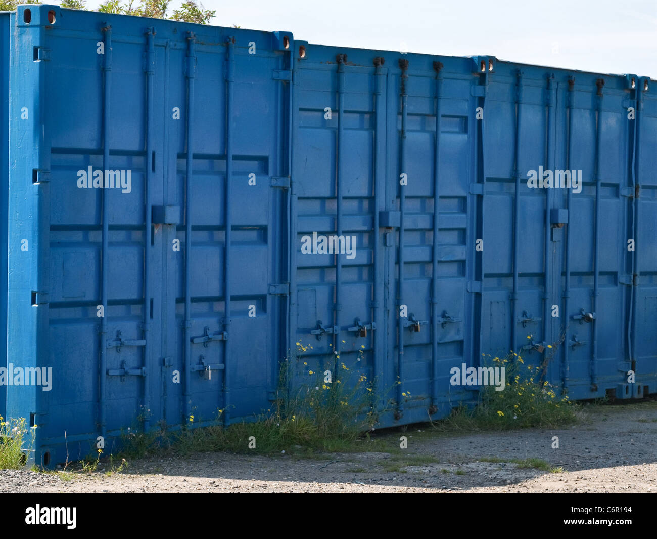 A row of three shipping containers Stock Photo - Alamy