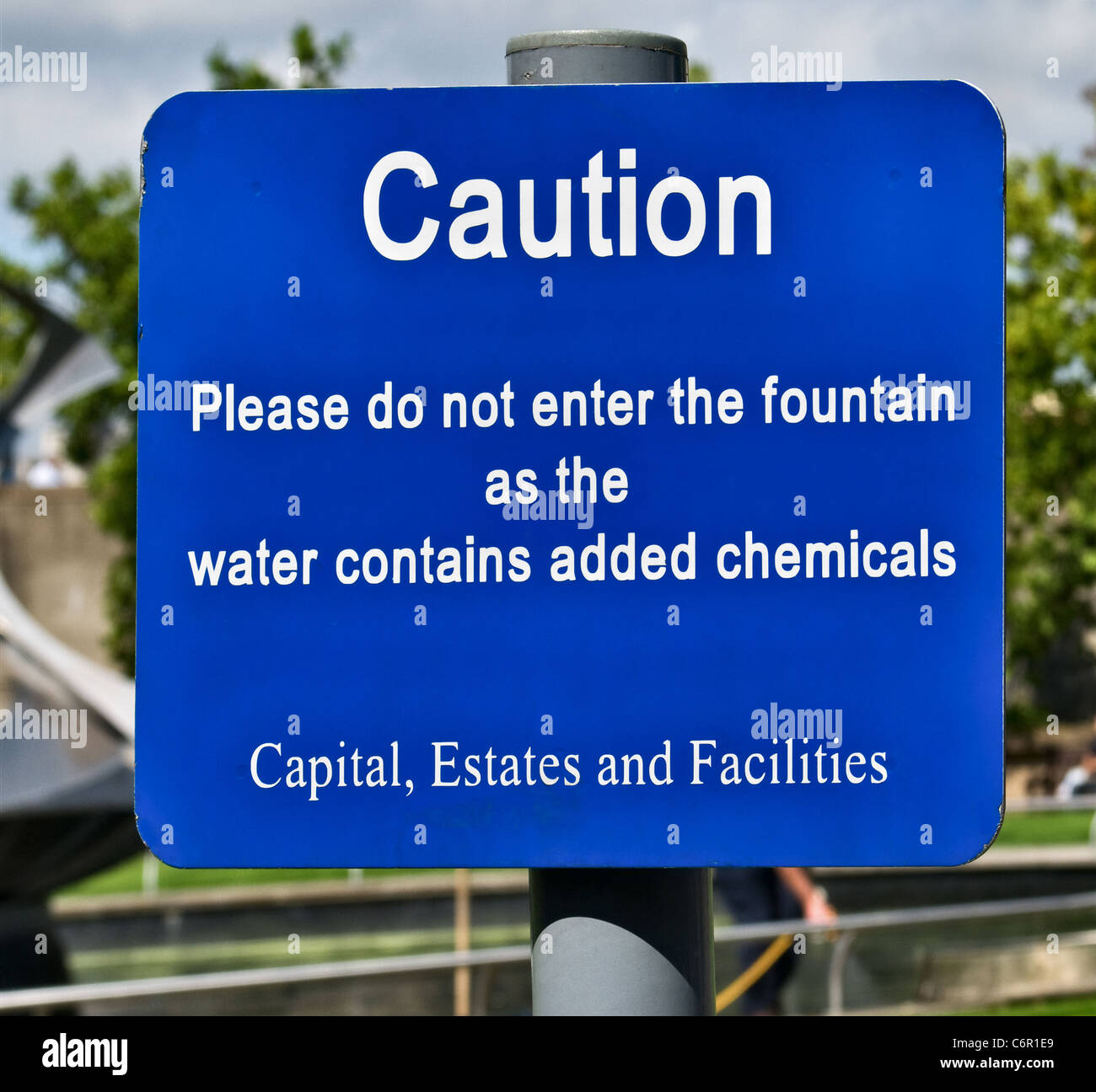 Caution Sign, please do not enter the fountain as the water contains ...