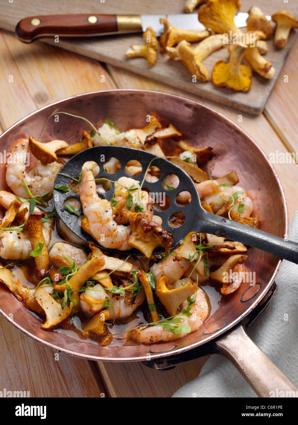 Prawns and girolle mushrooms Stock Photo - Alamy