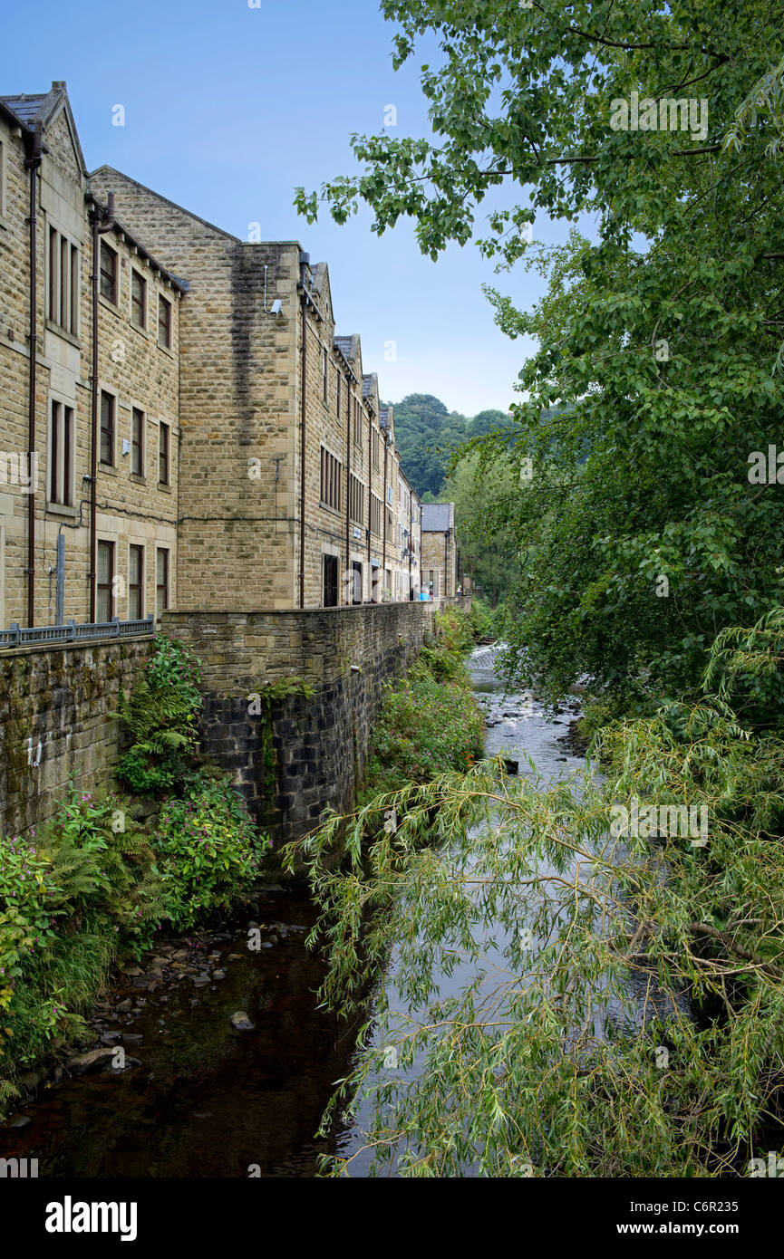 Old mill building lining the River Hebden in Hebden Bridge, West ...