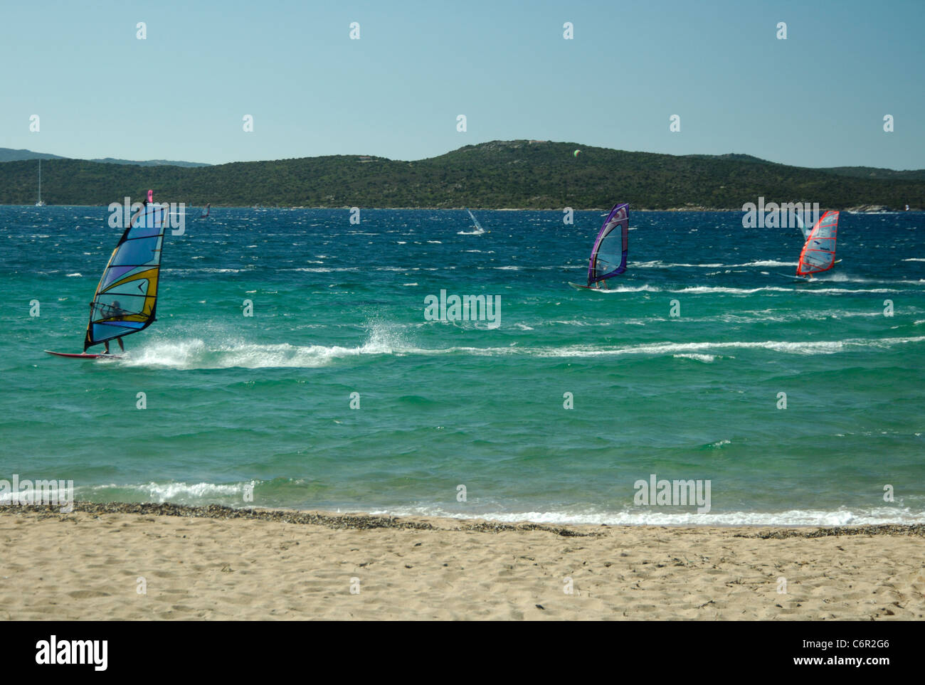 windsurf sailing at Porto Pollo bay and beach,Palau, Sardinia, Italy ...