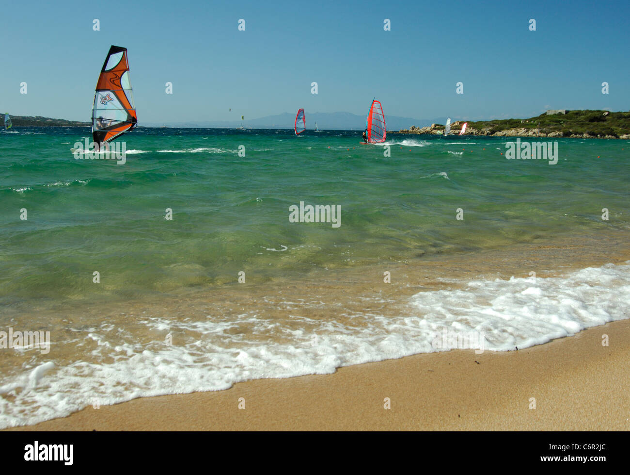 windsurf sailing at Porto Pollo bay and beach,Palau, Sardinia, Italy ...