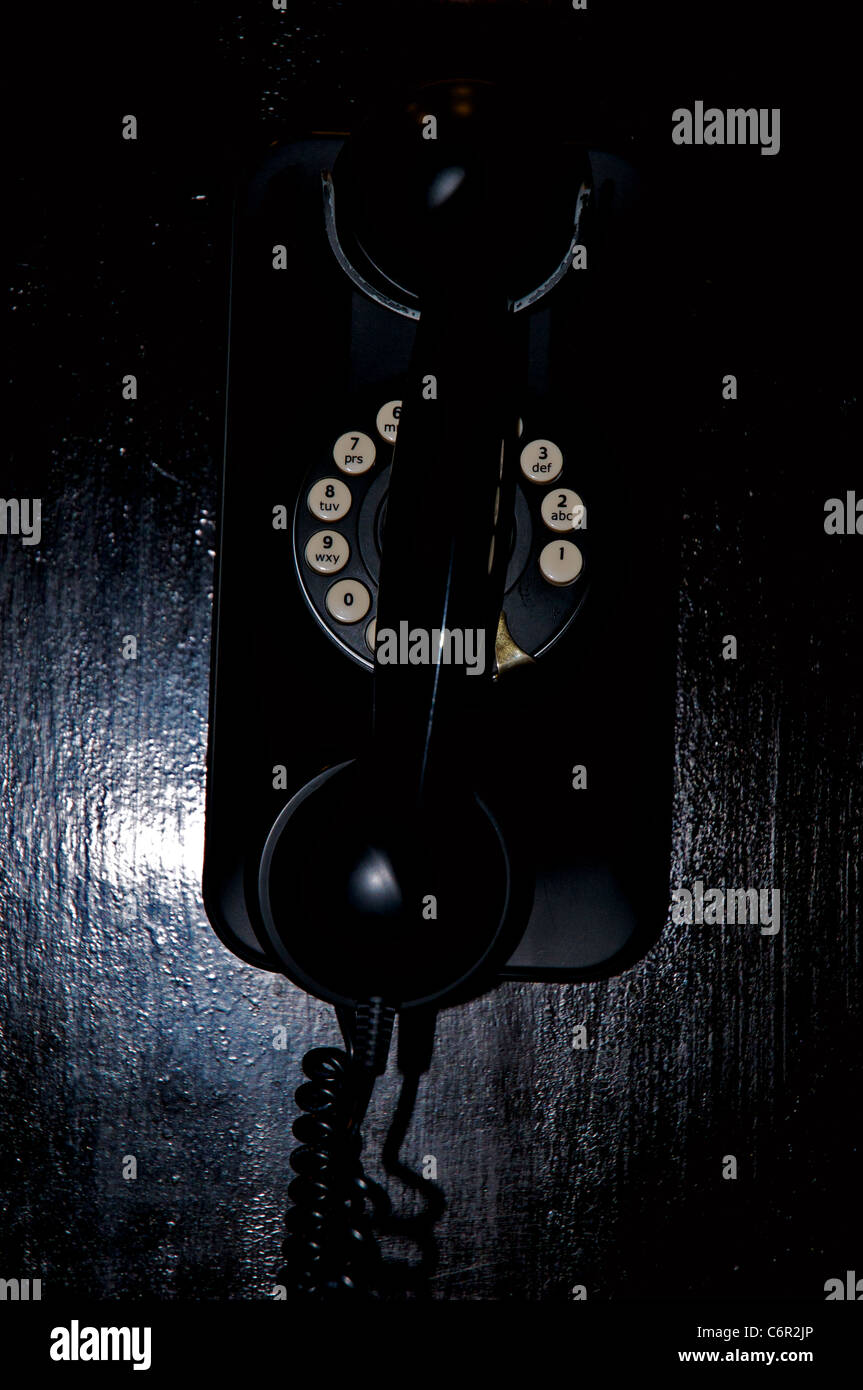 Old telephone hanging on the wall Stock Photo - Alamy