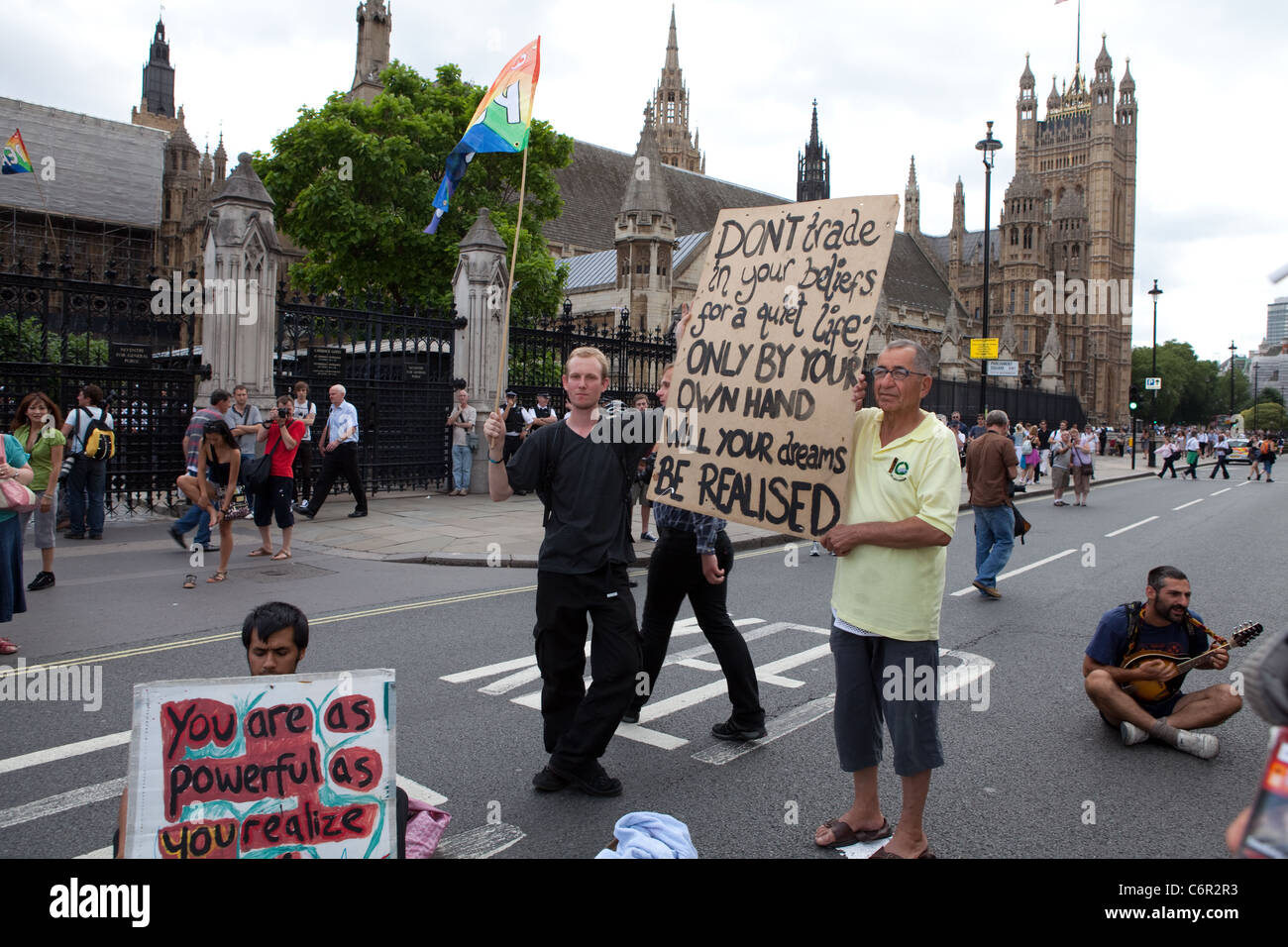 Democracy Village campers hold a peaceful sit-down protest outside the ...