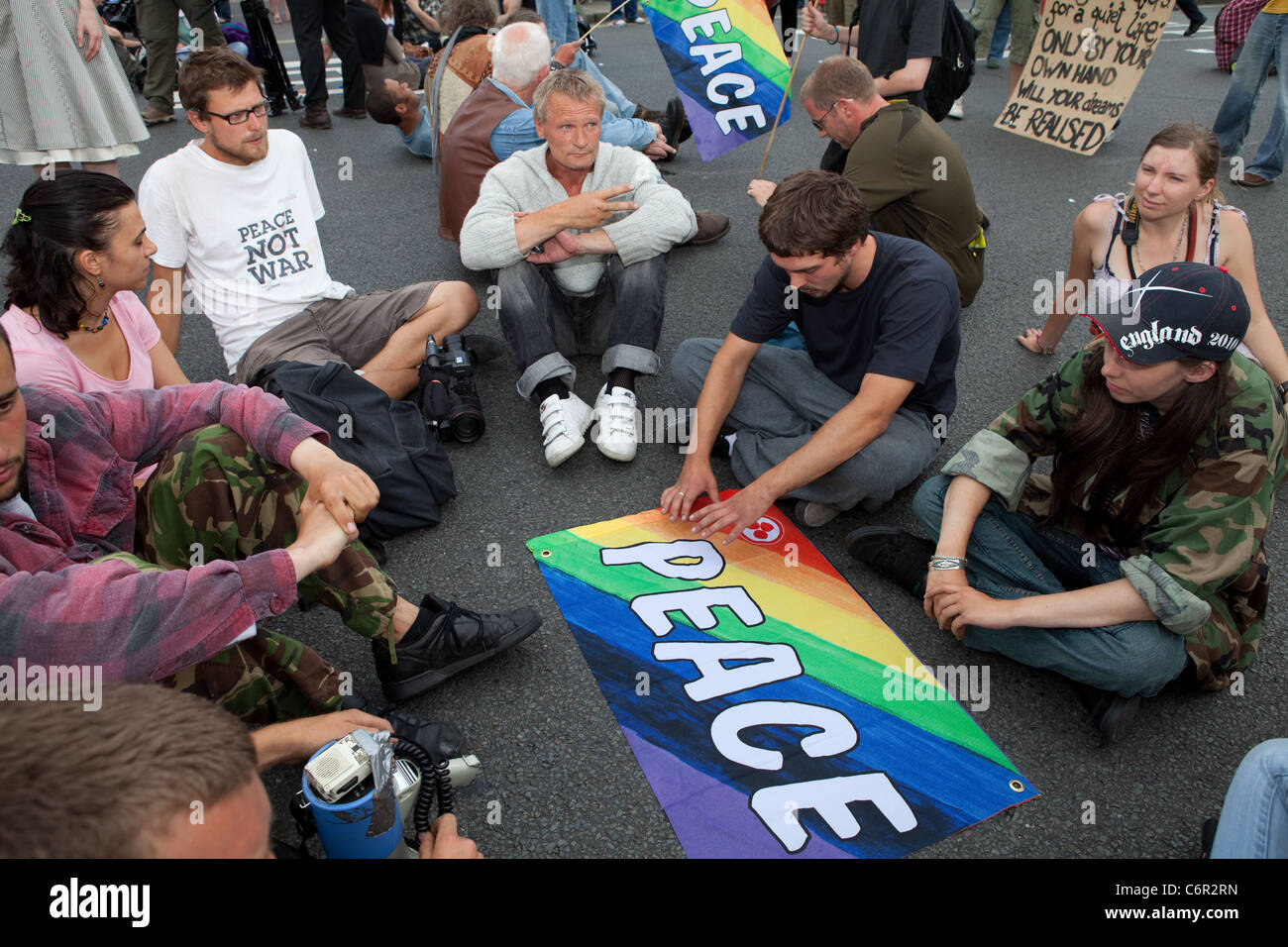 Democracy Village campers hold a peaceful sit-down protest outside the ...