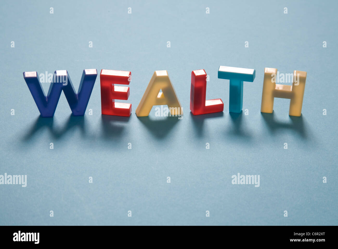 Wealth Word Spelling Stock Photo - Alamy
