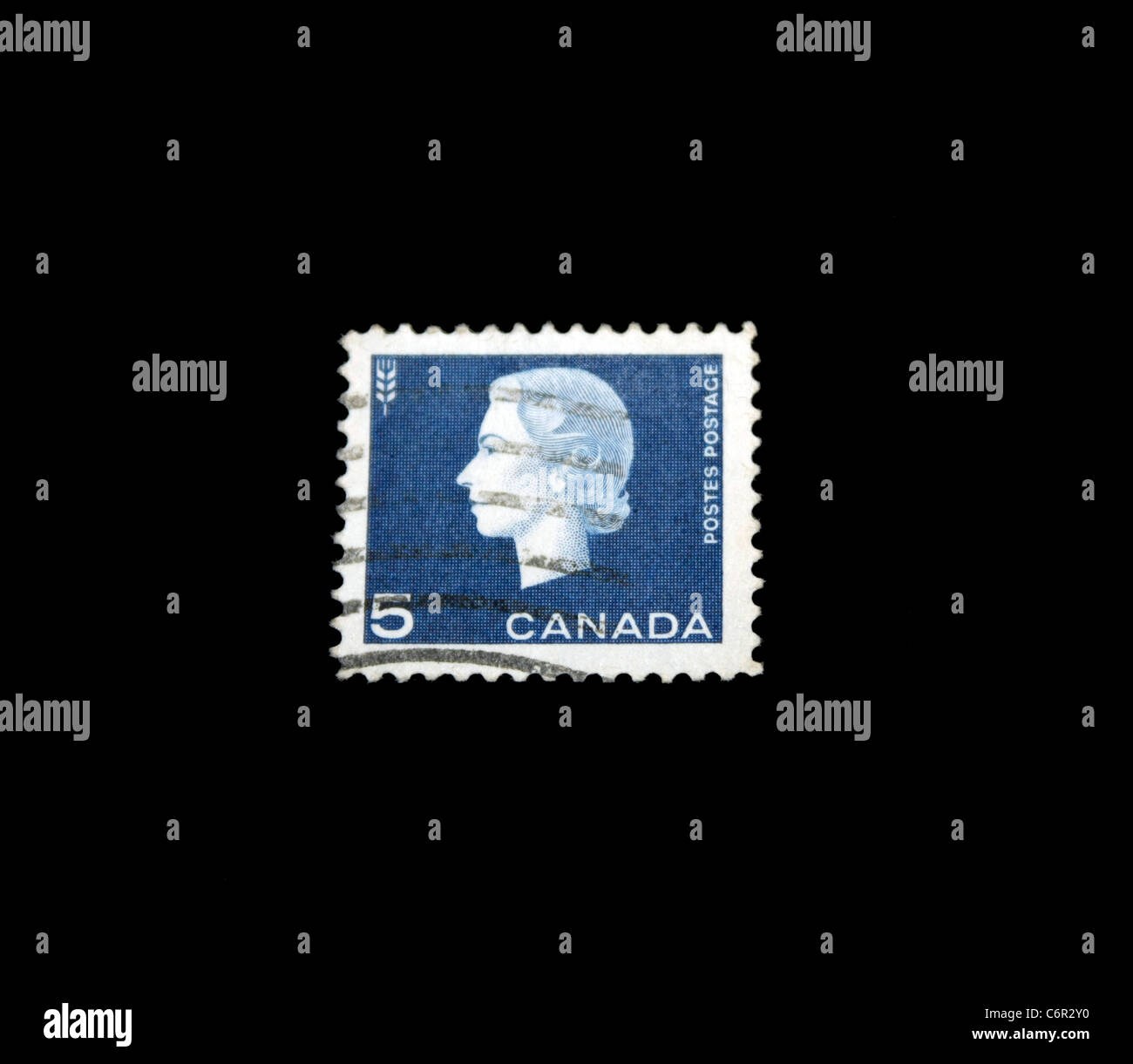 A Postage stamp isolated in black Stock Photo - Alamy