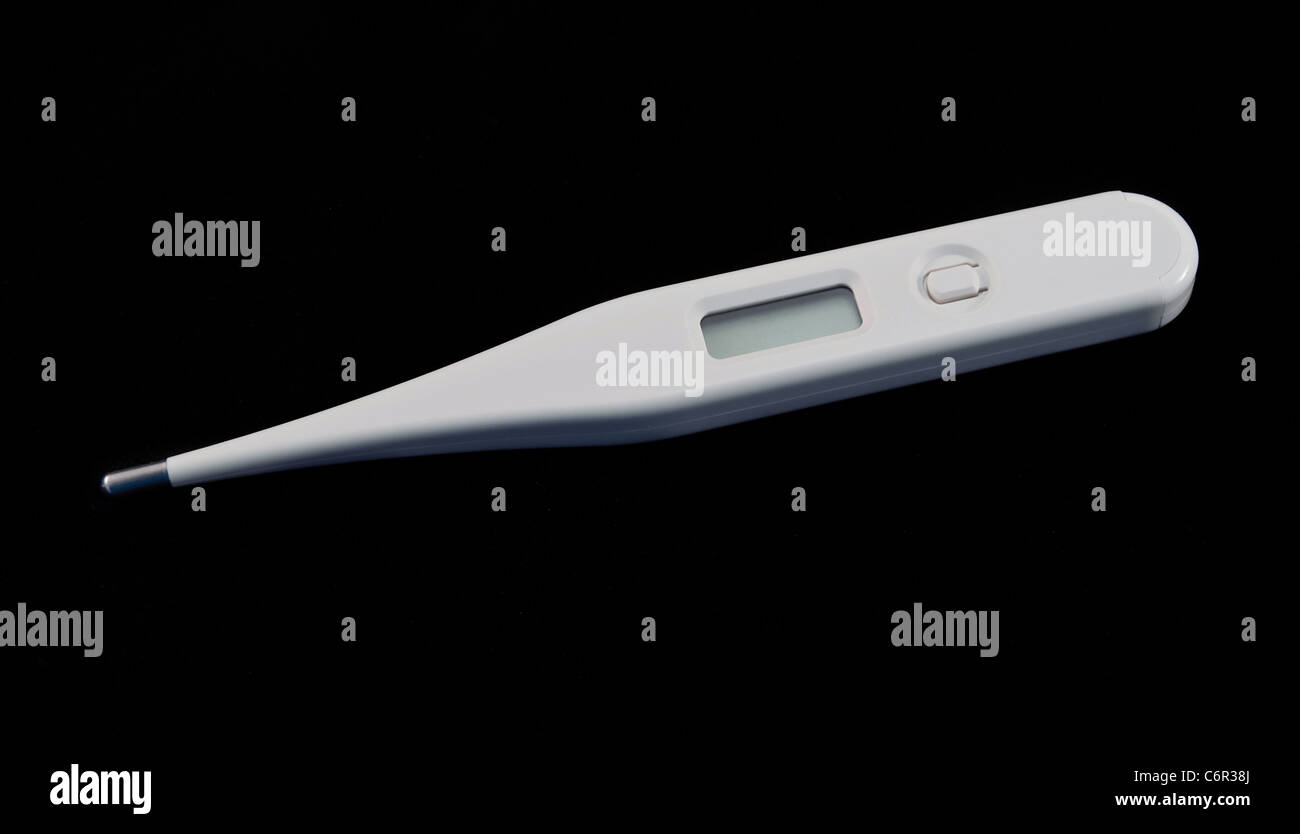 digital thermometer isolated on a black background Stock Photo - Alamy