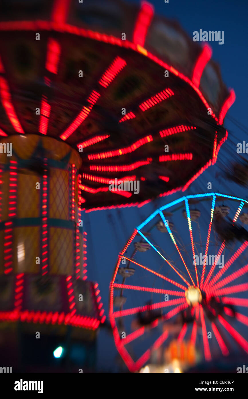 Carnival ride lights dusk motion hi-res stock photography and images ...