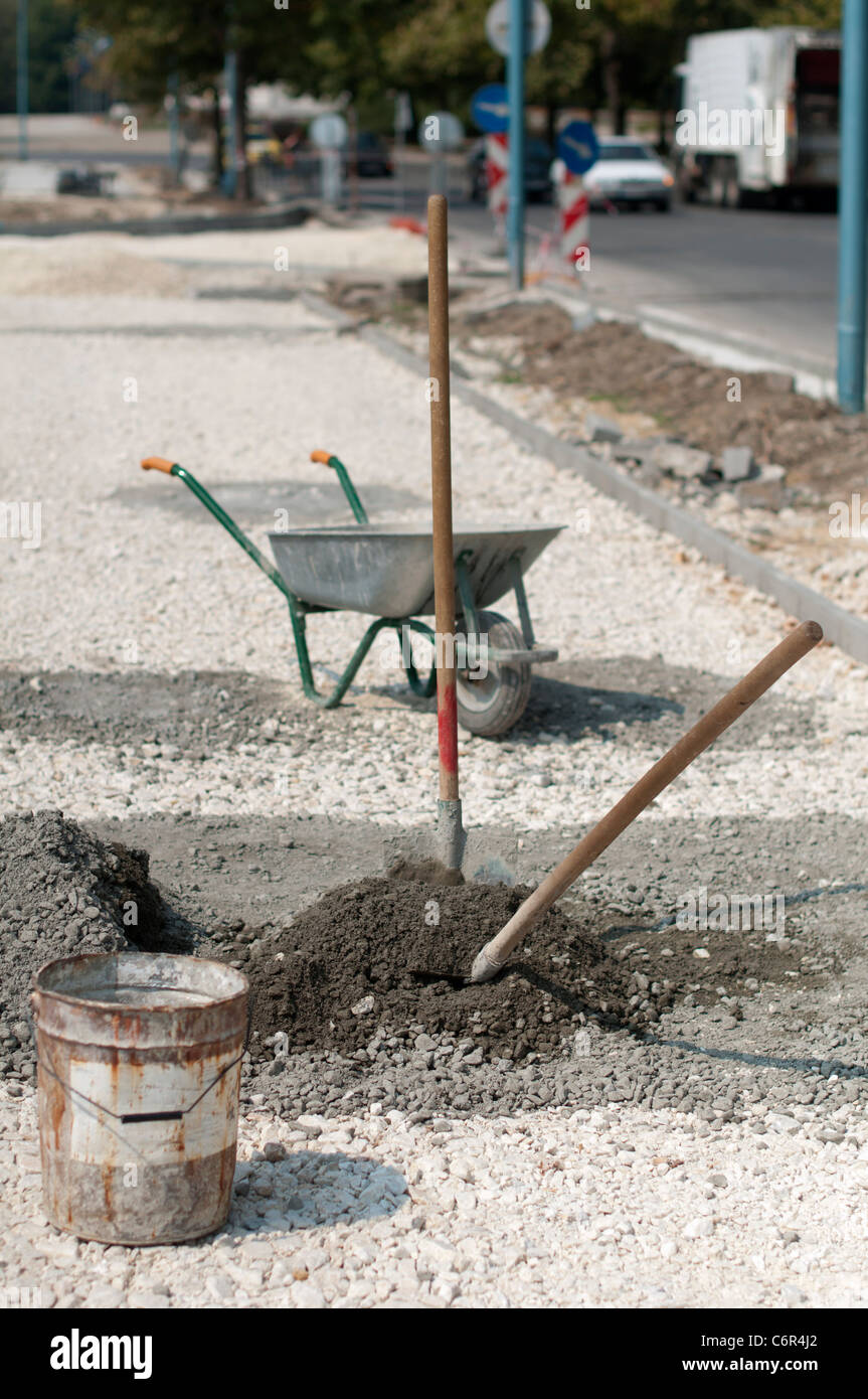 Tools for manual mixing of concrete. Bucket, shovel and wheelbarrow ...