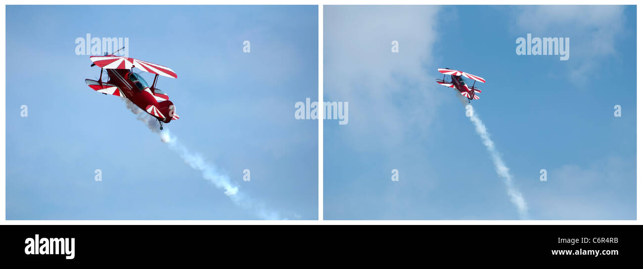 Red plane looping in a blue sky Stock Photo - Alamy