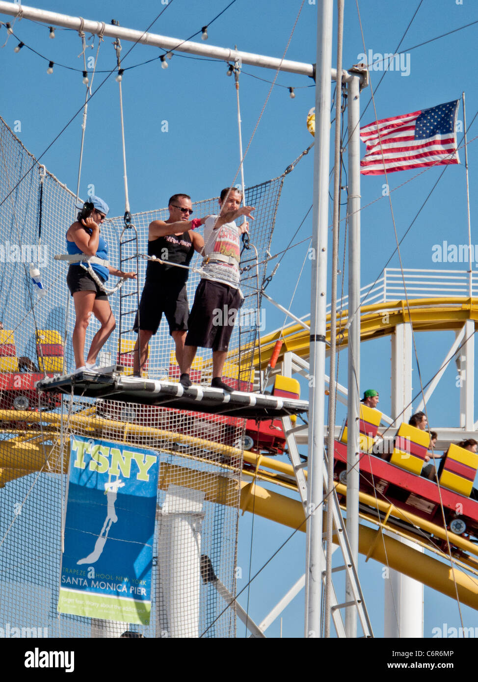 Professional trapeze performers give lessons to novices at the ...