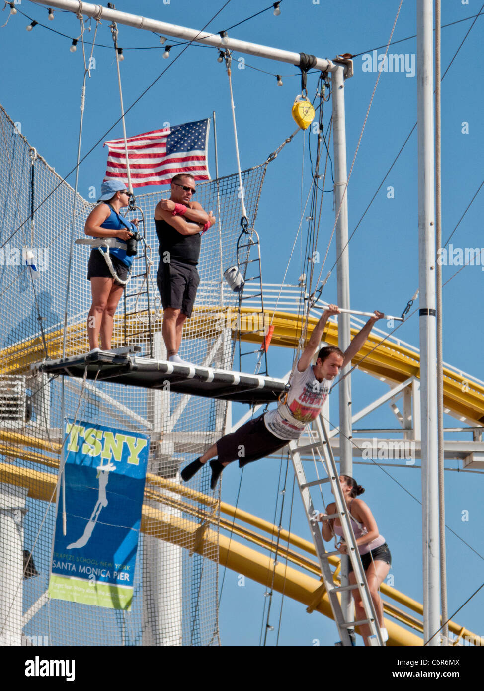 Professional trapeze performers give lessons to novices at the ...