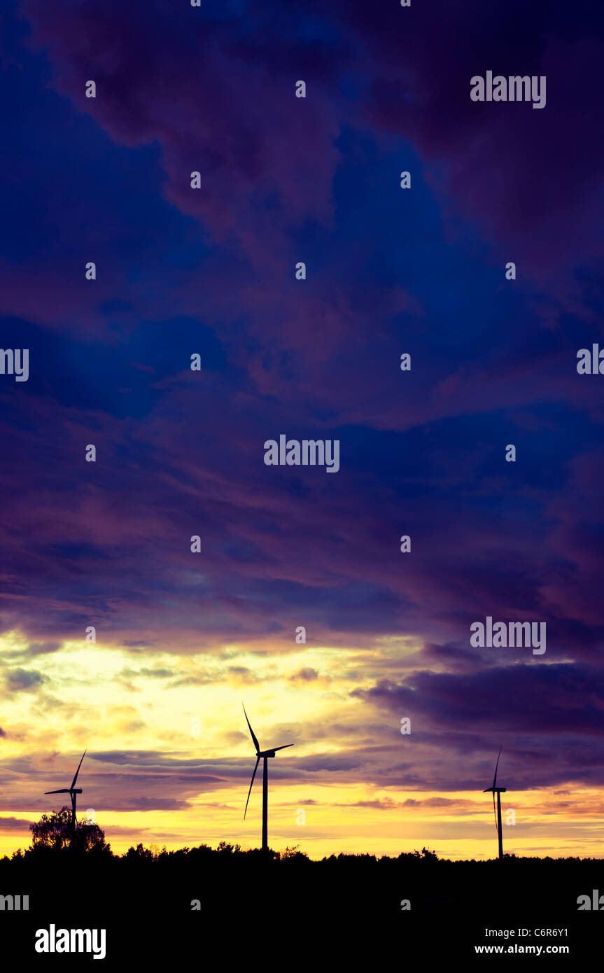 An image of wind turbines at sunset Stock Photo - Alamy