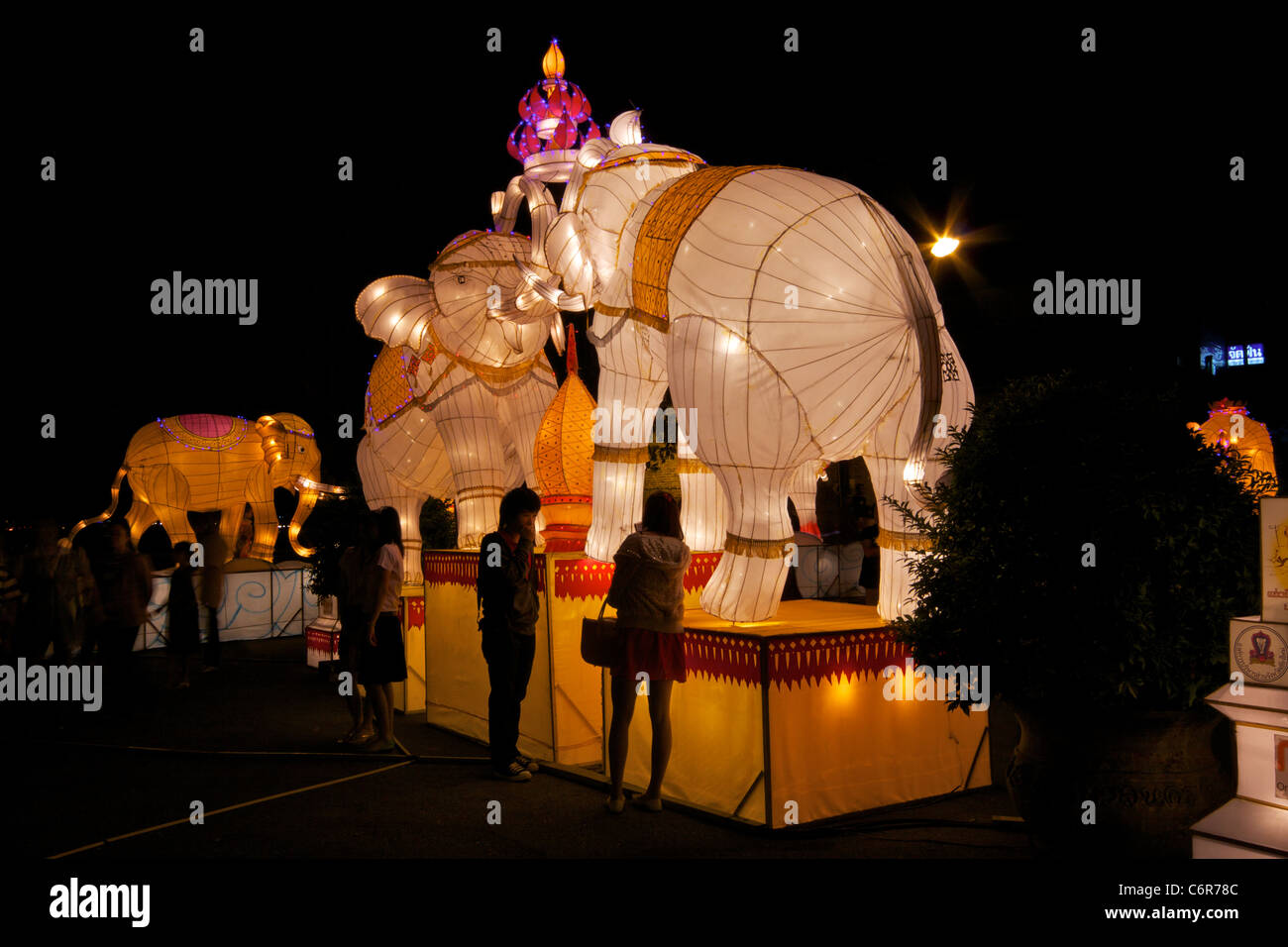 People view the display of colourful 'Lanna' elephant lanterns ...