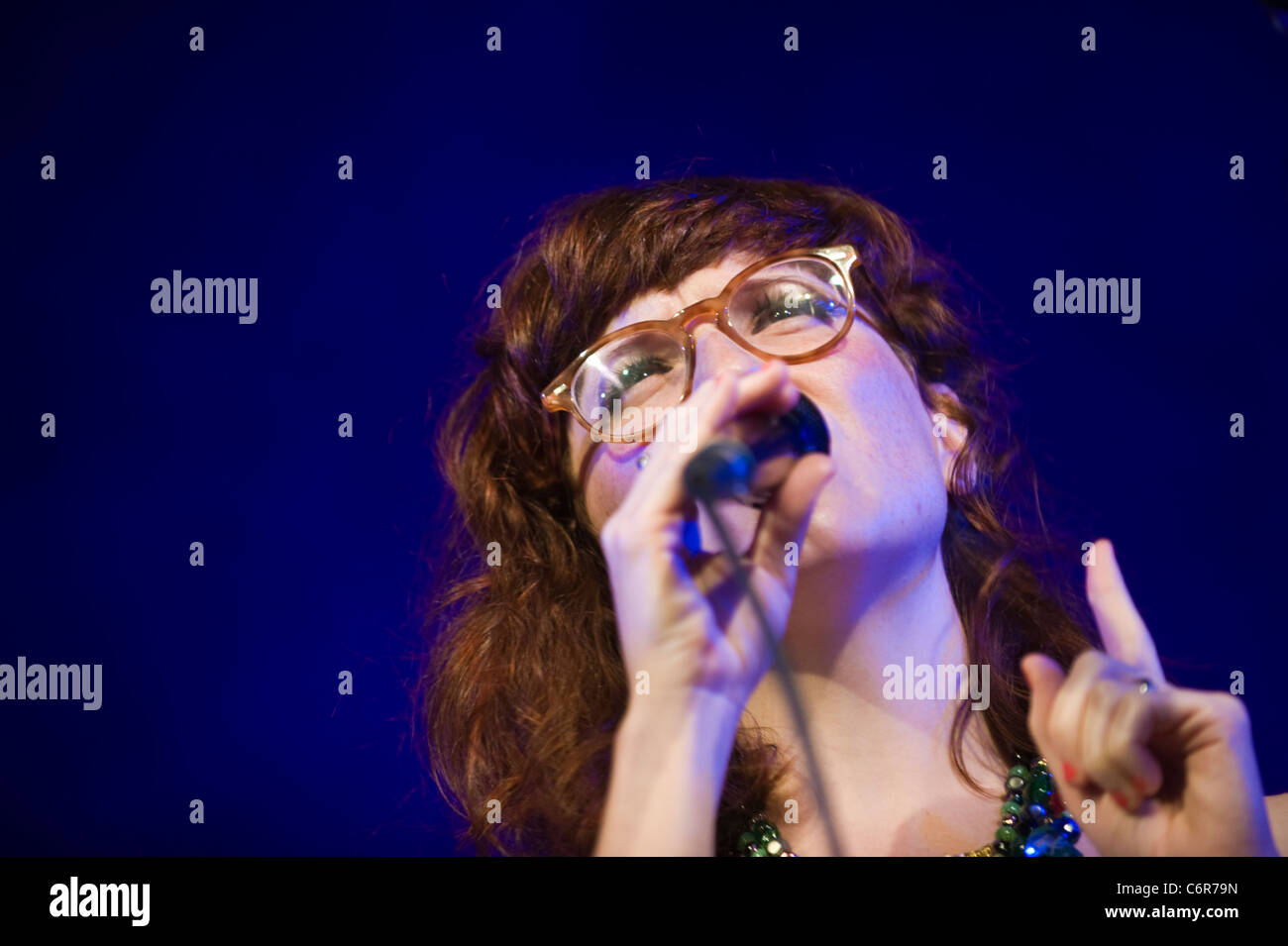 Alice Grant singing with the Matthew Herbert Big Band on stage at ...