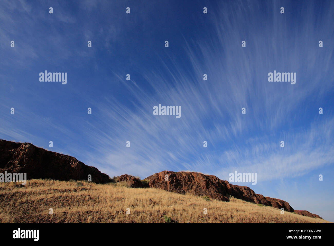 Desert landscape with dramatic clouds Stock Photo - Alamy