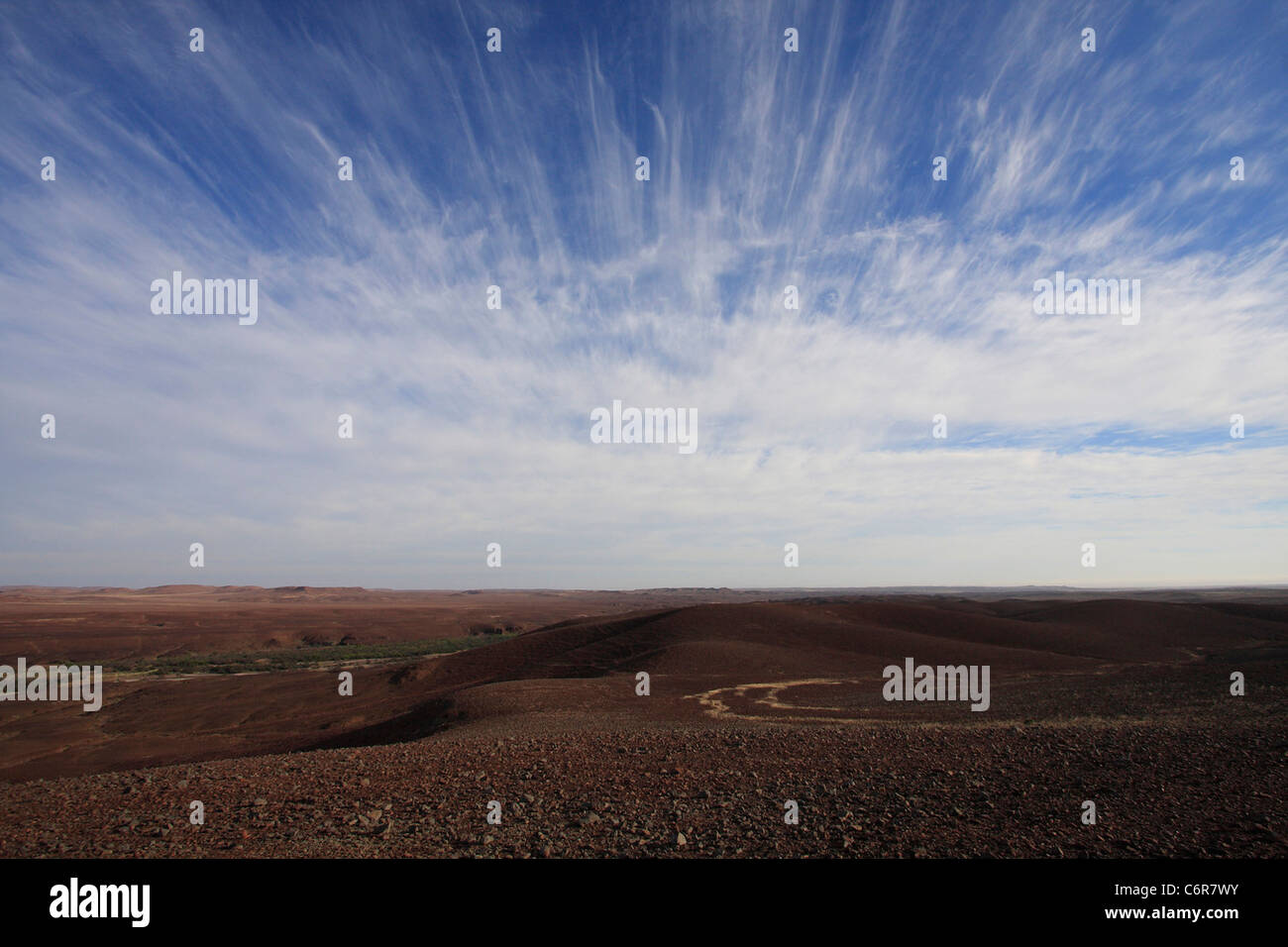 Desert landscape with dramatic clouds Stock Photo - Alamy