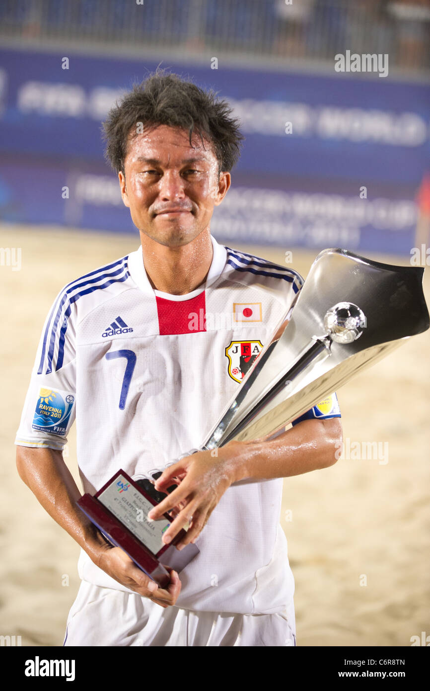 Takeshi Kawaharazuka (JPN) poses with the trophy after winning the ...