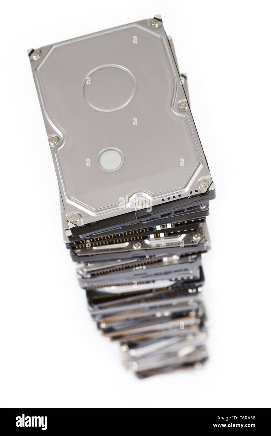 stack of hard drives on white background. Top view with selective focus ...