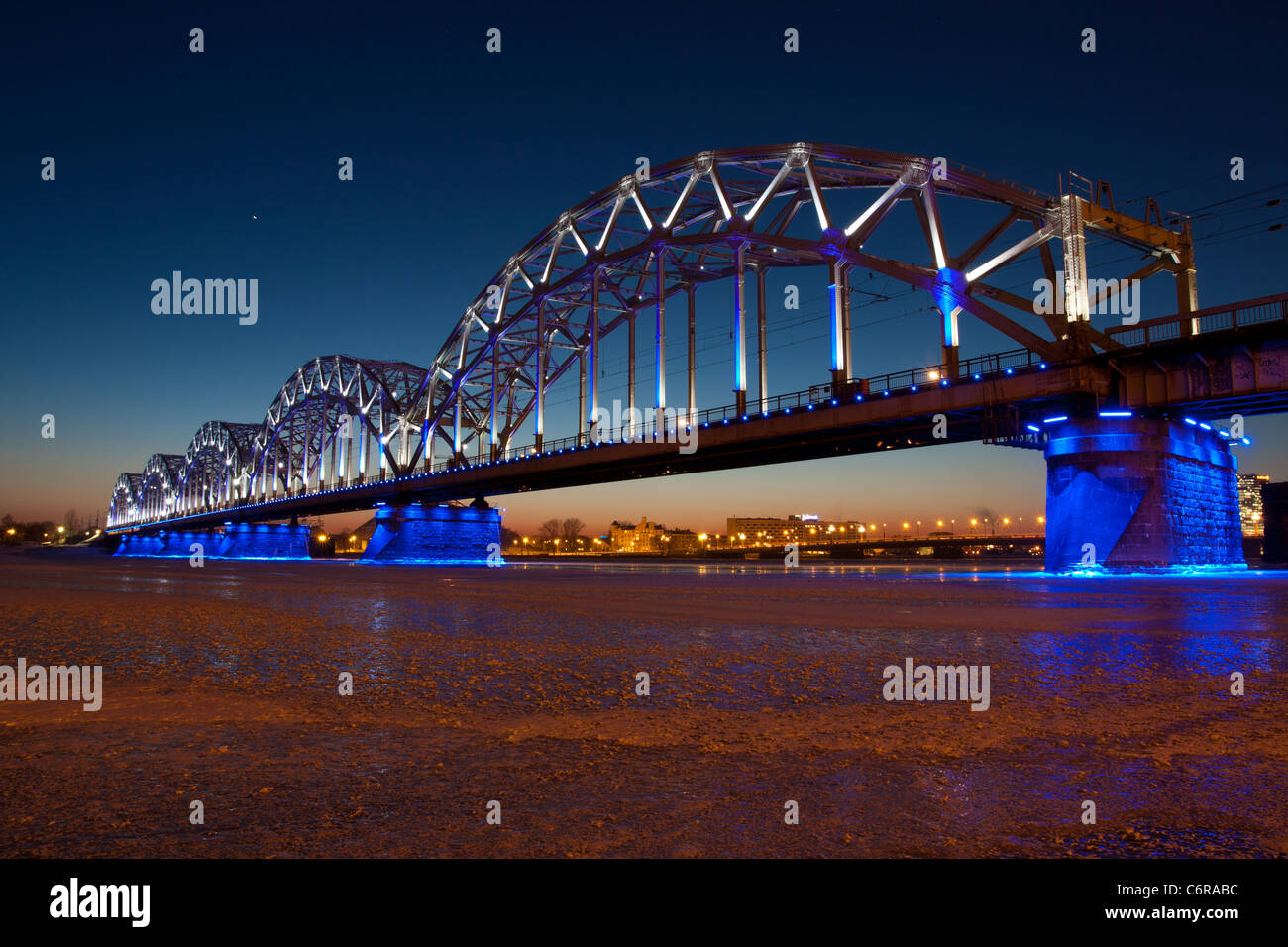 Railway bridge at night in winter close up Stock Photo - Alamy