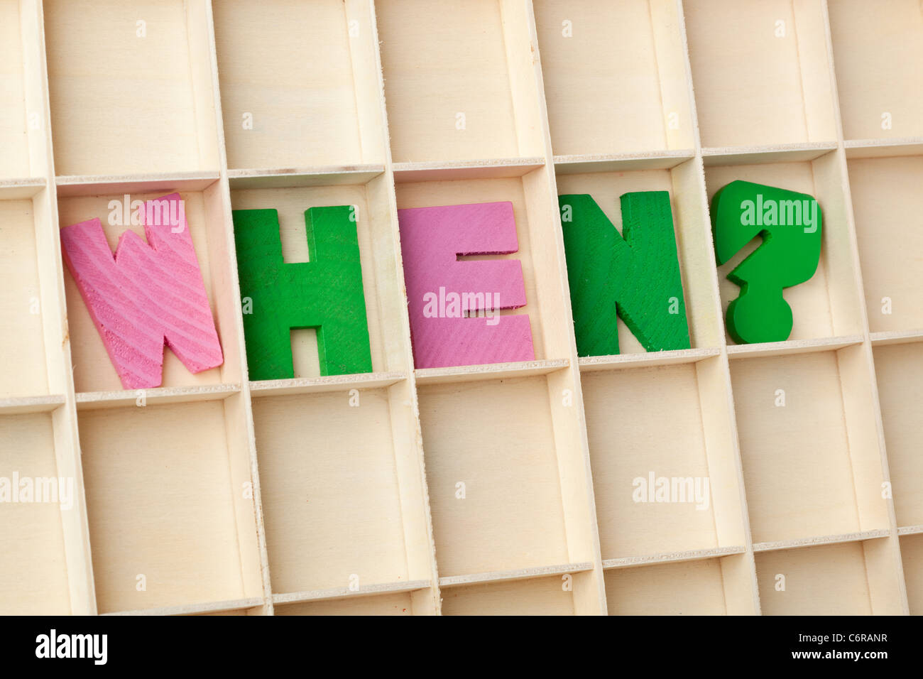 Wooden letter blocks forming the word WHEN Stock Photo - Alamy