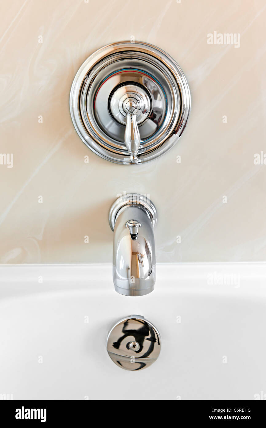Closeup of shiny chrome bathtub tap fixture Stock Photo - Alamy