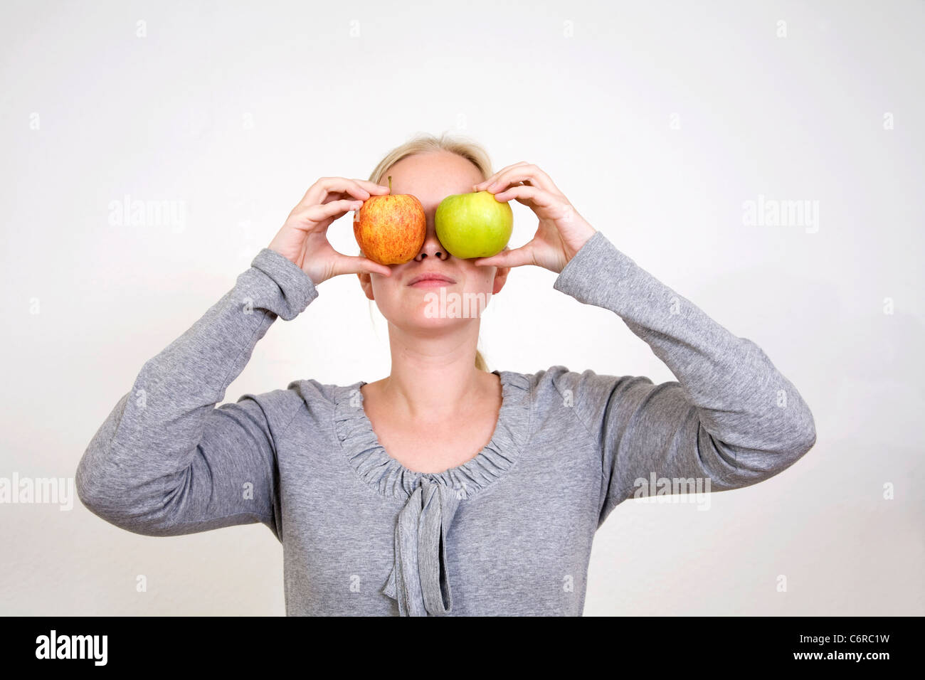 Woman with apple Stock Photo - Alamy