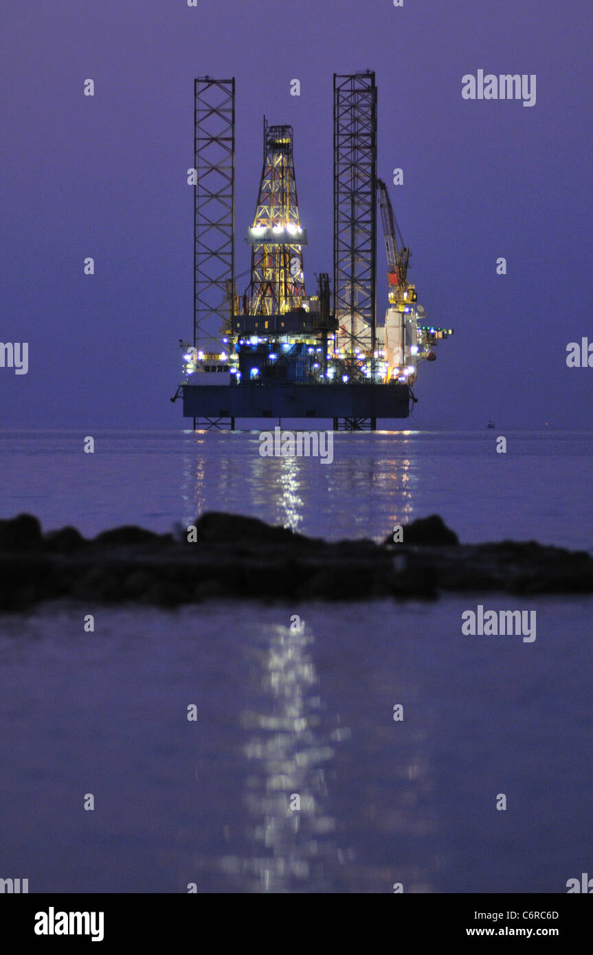 A jackup oil rig lies in the shallow waters of the Red Sea off the ...