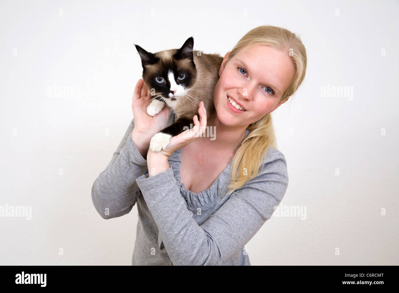 Young woman with cat Stock Photo - Alamy