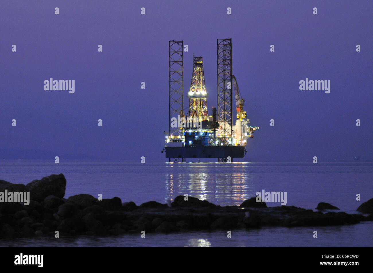 A jackup oil rig lies in the shallow waters of the Red Sea off the ...