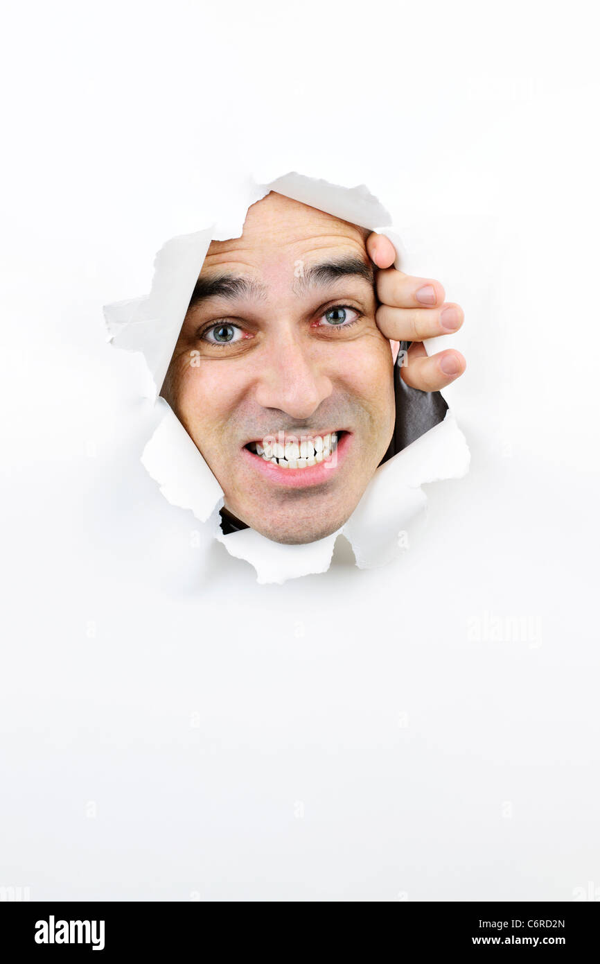 Hole In Paper With Angry Man Looking Through Stock Photo Alamy hole-in-paper-with-angry-man-looking-through-stock-photo-alamy