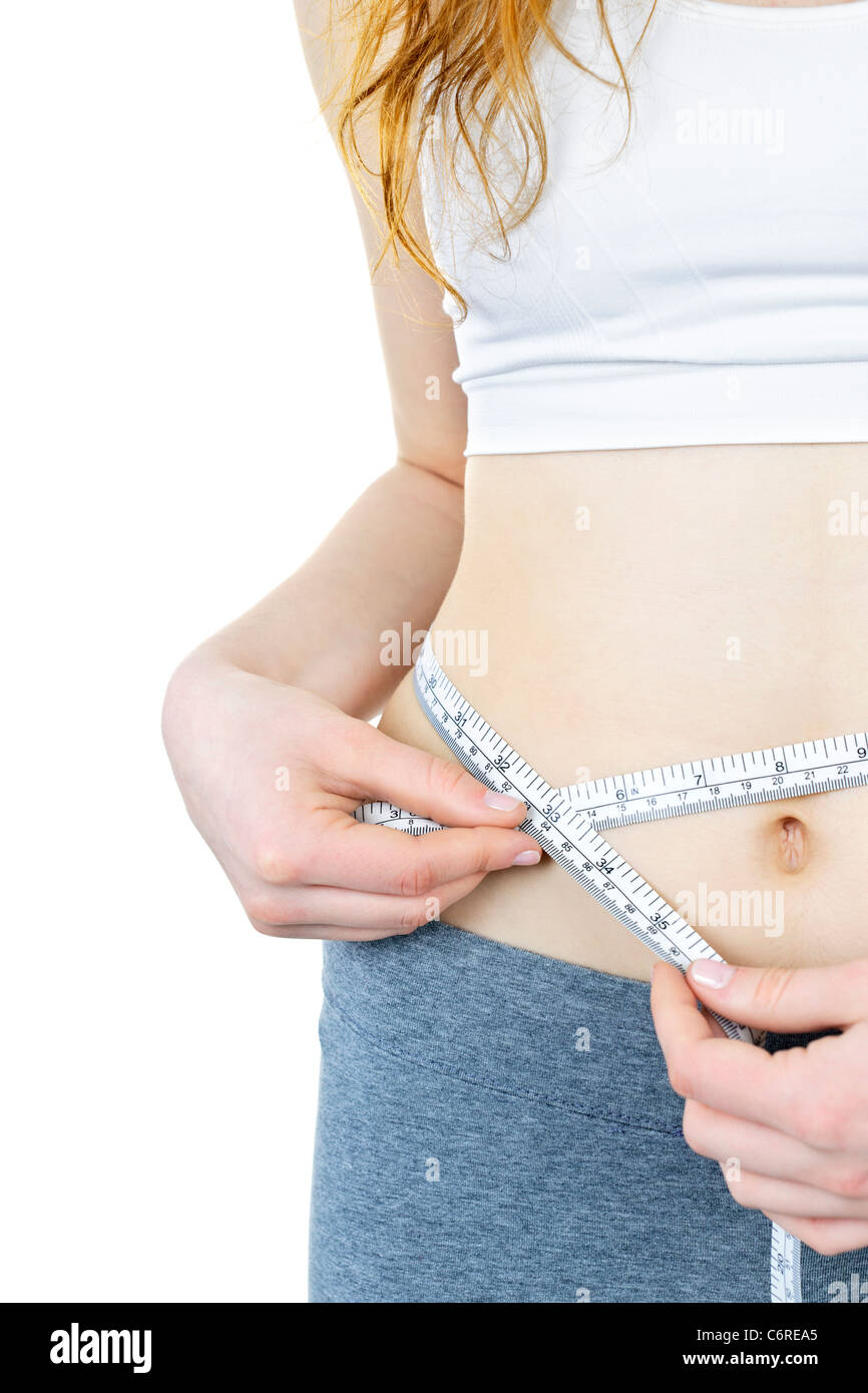 Fit young woman measuring waist with tape Stock Photo - Alamy Fit young woman measuring waist with tape Stock Photo - Alamy