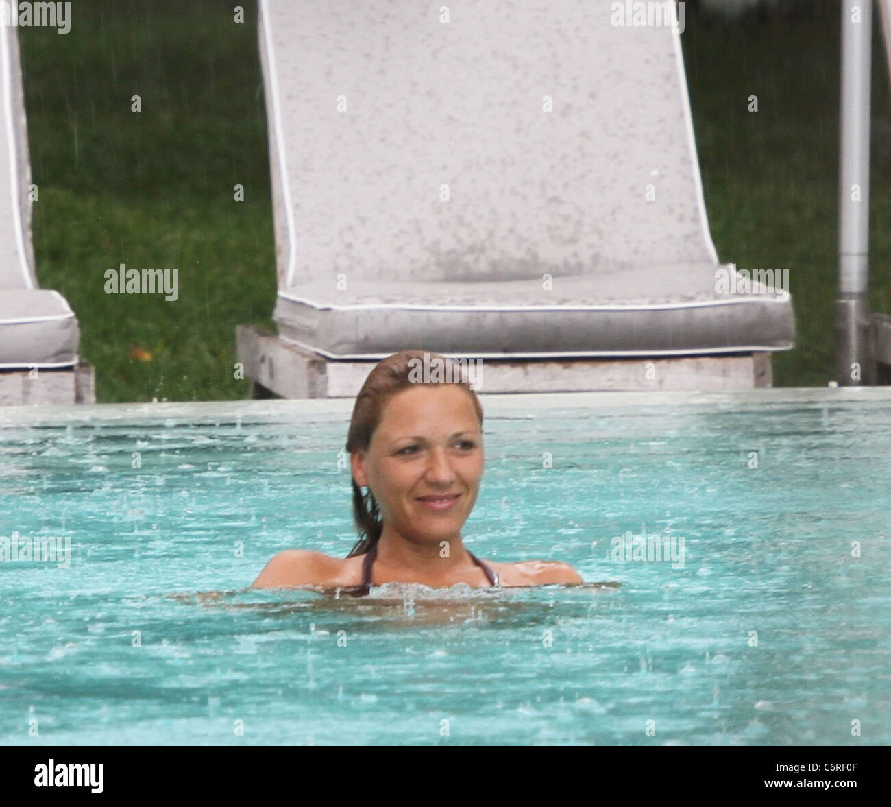 Simone Ballack swims in the hotel swimming pool in the rain, whilst on ...